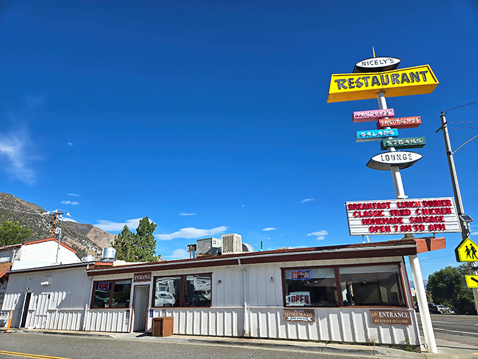 That iconic yellow sign against the Eastern Sierra sky isn't just a beacon for hungry travelers&mdash;it's a promise of comfort food paradise waiting inside.