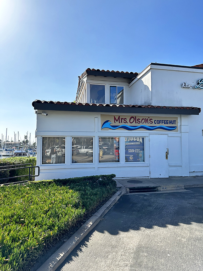 The "Coffee Hut" sign might be modest, but what happens inside this harborside haven is anything but ordinary.