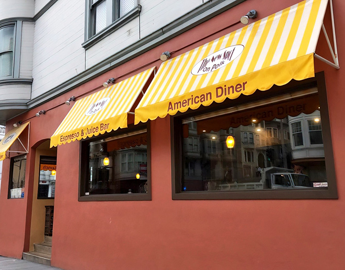 That cheerful yellow awning isn't just decoration &ndash; it's a breakfast beacon calling hungry souls home.