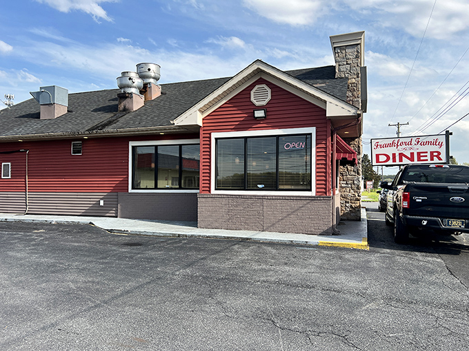 The iconic red exterior of Frankford Family Diner stands as a beacon of comfort food promise along Delaware's roadside, where culinary magic awaits behind those unassuming walls.