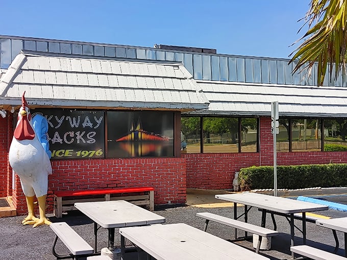 The iconic chicken statue stands guard outside Skyway Jack's like a feathered bouncer who's seen it all but still welcomes you with open wings.