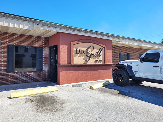 The unassuming brick exterior of Dixie Grill hides culinary treasures within. Like finding a Picasso at a yard sale, the modest façade belies the magic happening inside.