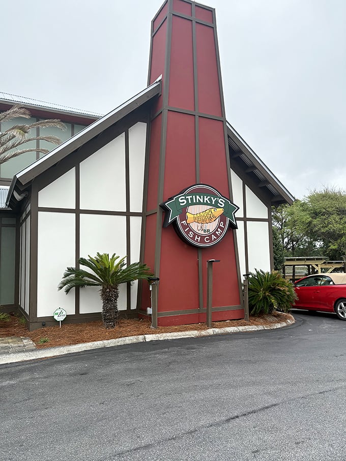The unassuming exterior of Stinky's Fish Camp belies the culinary treasures within. That distinctive red chimney stands like a lighthouse for hungry seafood lovers.
