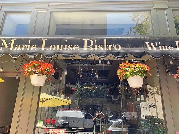 The charming exterior of Marie Louise Bistro beckons like a Parisian daydream on a Baltimore corner. Those sidewalk tables? Pure European magic at twilight.