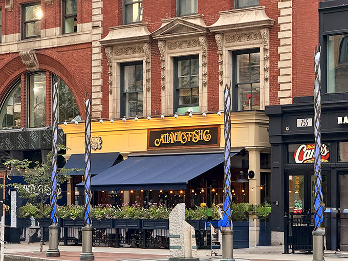 The golden facade of Atlantic Fish Company stands out on Boylston Street like a beacon for seafood lovers&mdash;nautical elegance in Boston's Back Bay.