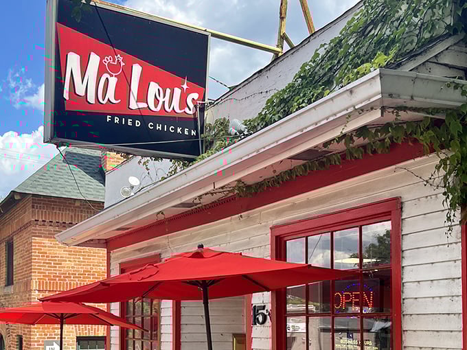 The white clapboard building with bold red trim isn't just eye-catching&mdash;it's a beacon for fried chicken pilgrims seeking salvation in crispy, juicy form.