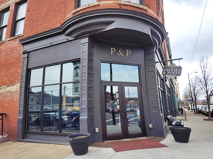 The corner entrance to Patties & Pints stands like a culinary lighthouse in downtown Portsmouth, its dark gray exterior and gold lettering promising delicious refuge from ordinary dining.