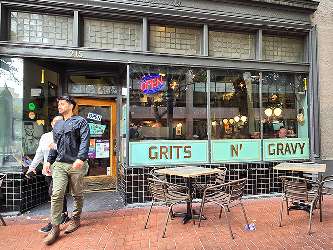 The turquoise storefront of Grits N' Gravy beckons like a Southern oasis in Portland's urban landscape. That neon "OPEN" sign might as well say "Heaven This Way."