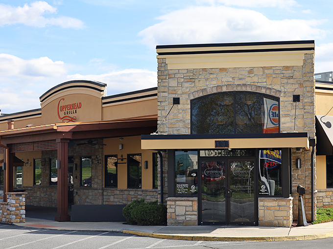 The unassuming exterior of Copperhead Grille hides culinary treasures within, like finding a secret food paradise behind stone and stucco.
