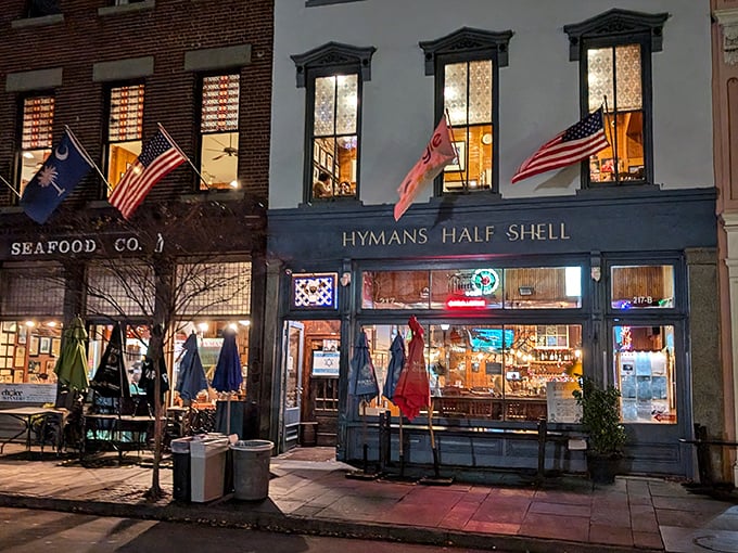 The iconic blue and white fa&ccedil;ade of Hyman's glows like a beacon for hungry souls wandering Charleston's historic streets at dusk.