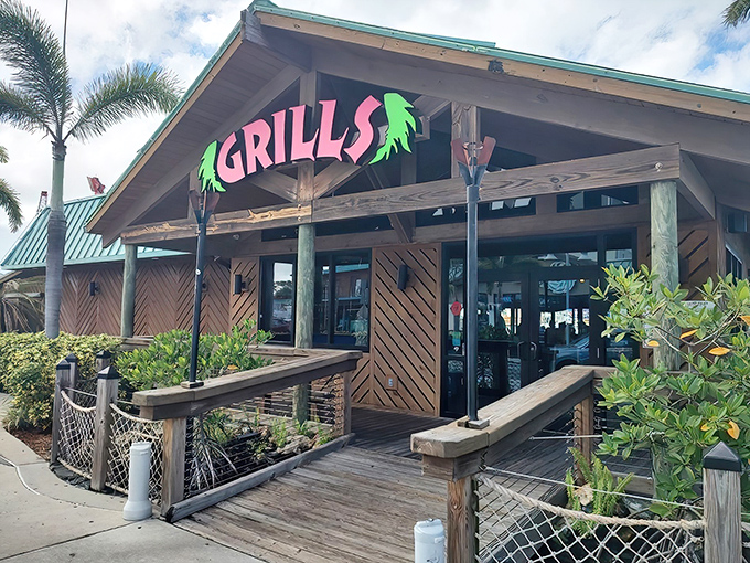 Welcome to paradise! Grills' vibrant sign and weathered wood exterior promise the authentic Florida experience that chain restaurants can only dream about.