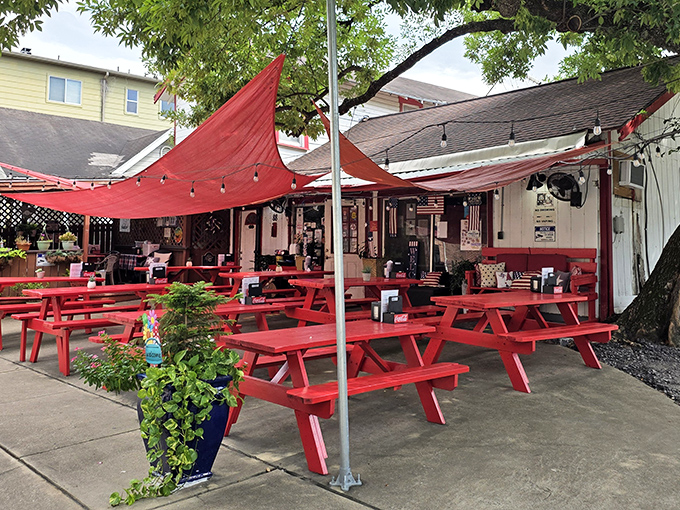 Those vibrant red picnic tables aren't just furniture&mdash;they're Houston's version of the red carpet, inviting you to the best burger show in town.