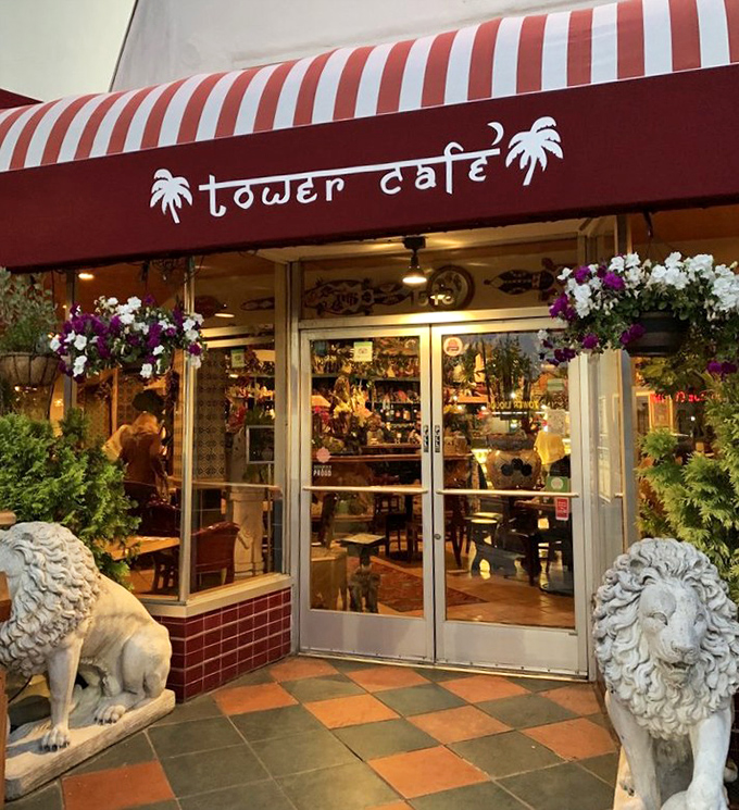 Stone lions stand guard at Tower Cafe's entrance, as if saying "Prepare your taste buds for an adventure worth roaring about."