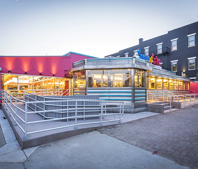 The neon-bright sign of Sugar n' Spice beckons like a colorful lighthouse for hungry souls navigating Cincinnati's breakfast scene.
