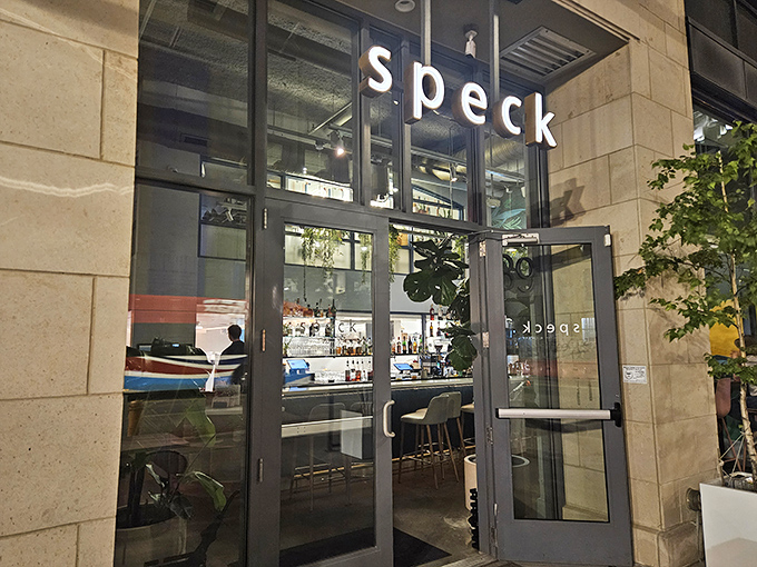 The sleek exterior of Speck beckons like a culinary lighthouse in downtown Columbus, promising Italian delights behind those glass doors.