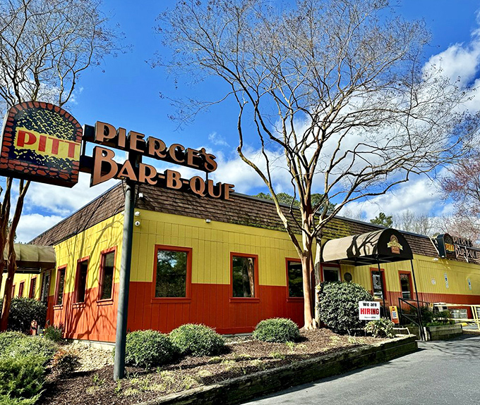 The unmistakable yellow and orange exterior of Pierce's stands out like a barbecue beacon, calling hungry travelers from miles around.