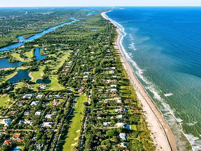 Where golf courses meet coastline. This aerial view showcases Merritt Island's perfect balance of developed amenities and natural beauty along the Atlantic.