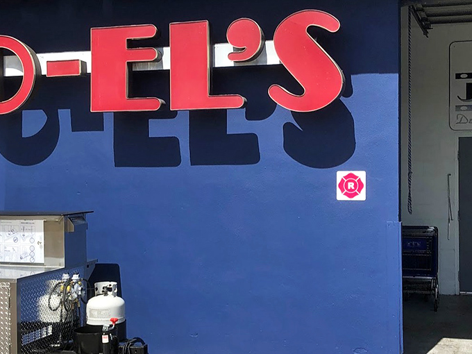 That pink-on-blue sign practically winks at you from the street &ndash; Florida's most colorful kosher secret.