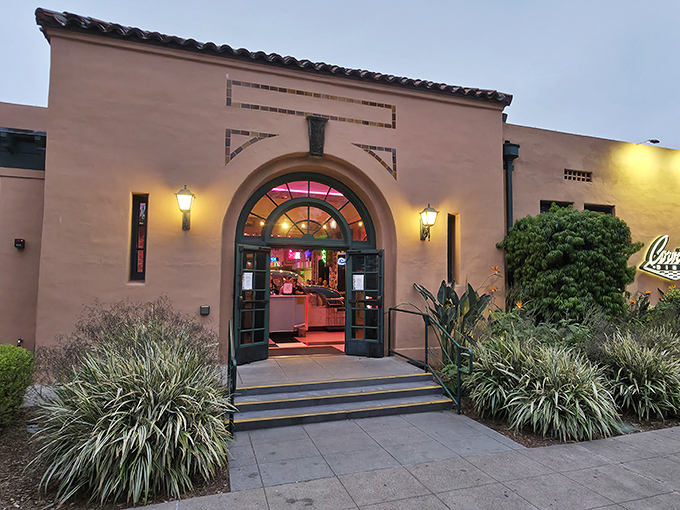 The Spanish Colonial exterior of Corvette Diner plays it cool, hiding the neon explosion waiting inside like Clark Kent concealing Superman.