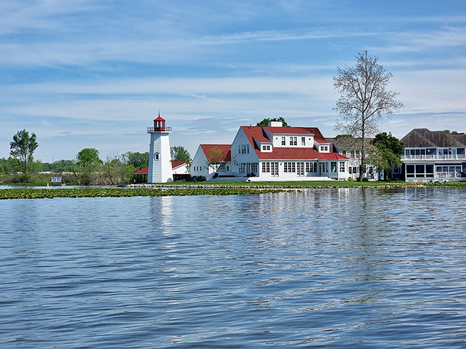 The iconic Buckeye Lake lighthouse stands sentinel against a perfect Ohio sky, like a maritime guardian watching over this inland oasis.