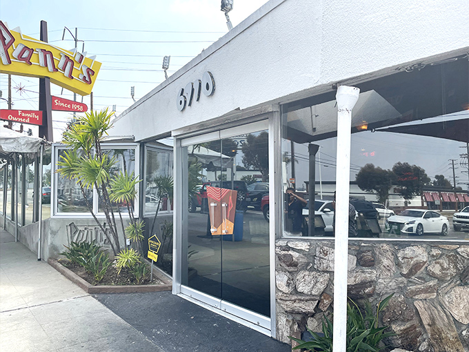 The iconic Pann's exterior beckons with mid-century charm and that unmistakable neon sign &ndash; architectural eye candy that promises delicious comfort inside.