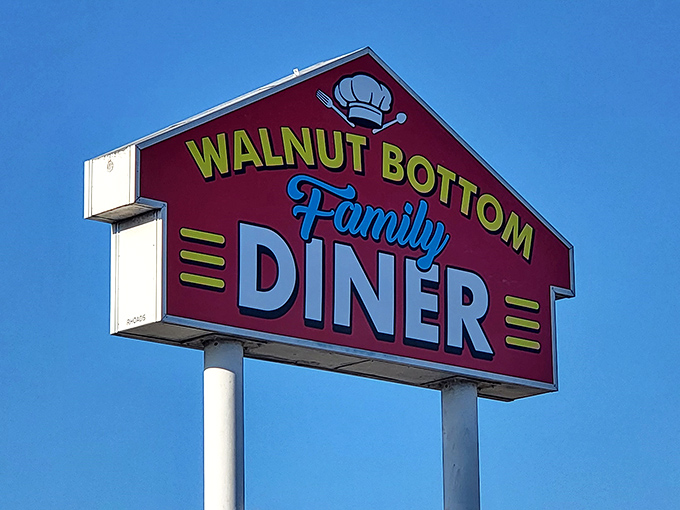 That burgundy sign with the cheerful chef's hat isn't just advertising &ndash; it's practically sending smoke signals to hungry travelers everywhere.