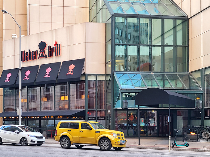 The unmistakable Weber Grill Restaurant facade in downtown Indianapolis, where that giant red kettle isn't just decoration&mdash;it's a promise of what awaits inside.