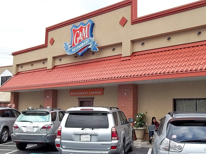 The iconic red-roofed G&M Restaurant stands like a culinary lighthouse, beckoning seafood lovers from miles around to its Linthicum Heights haven.