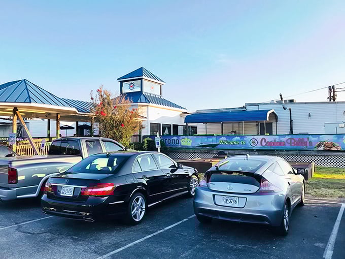 Maryland's seafood temple stands proud against the sky, its blue roof and welcoming sign promising crustacean salvation to all who enter.
