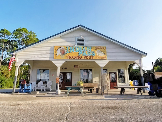 The unassuming white clapboard exterior of Indian Pass Raw Bar stands like a seafood sanctuary, promising treasures from the Gulf that fancy restaurants can only dream about.