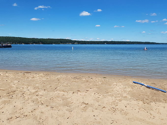 Crystal clear waters meet golden sands at Otsego Lake, where Michigan's version of the Caribbean awaits without the passport hassle.