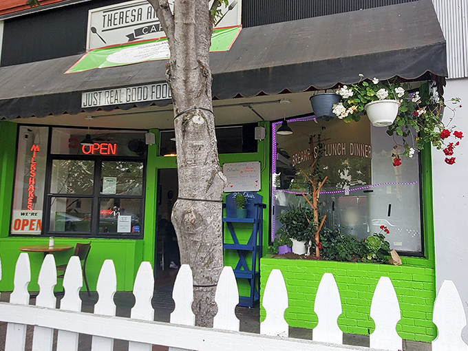 The lime green exterior with its charming white picket fence isn't just inviting&mdash;it's practically daring you not to smile as you approach.