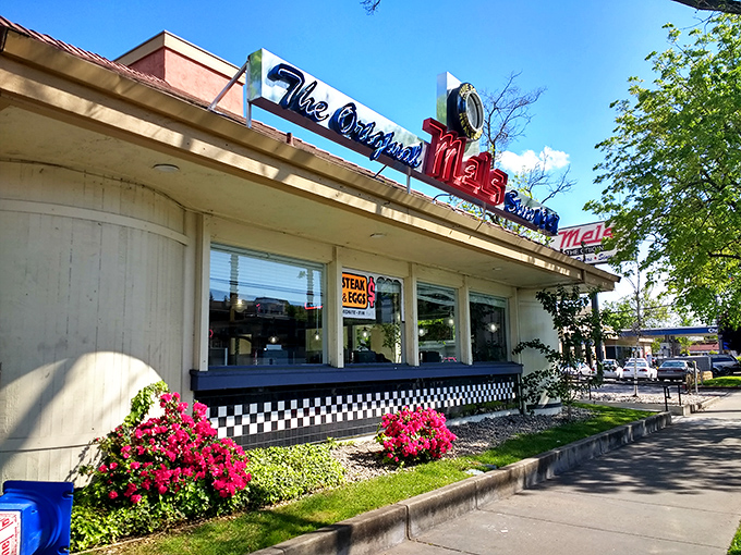 The neon sign at The Original Mels Diner glows like a beacon of comfort food, promising nostalgic flavors and that unmistakable diner hospitality.