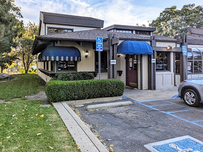 A classic California steakhouse facade that whispers rather than shouts&mdash;those blue awnings are like a secret handshake among steak aficionados.