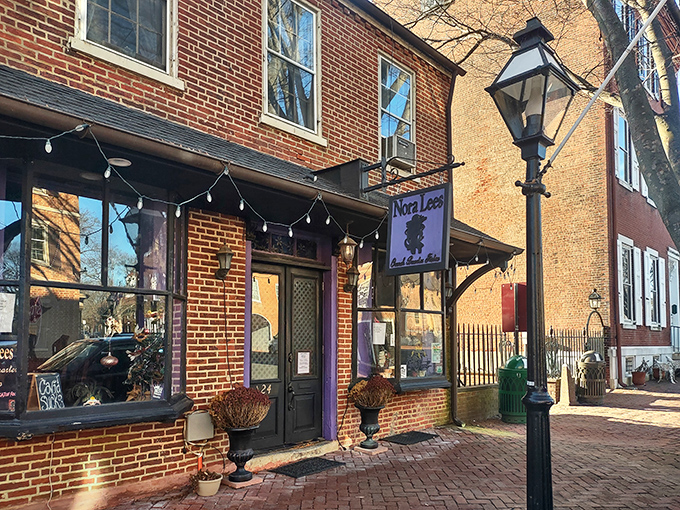 The unassuming brick exterior of Nora Lees hides culinary treasures within, like a delicious secret waiting to be discovered on New Castle's historic streets.