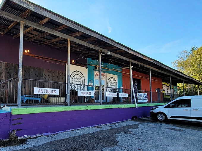 The colorful exterior of Talquin Trading Co. beckons with its vibrant purple foundation and rustic covered porch&mdash;Florida's answer to treasure hunting without a metal detector.