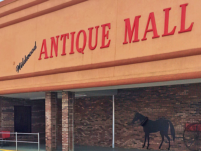 That classic red signage promises a journey through time. The silhouette of a horse and carriage hints at the historical wonders awaiting discovery.
