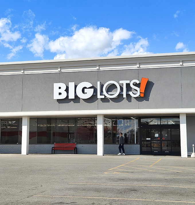 The Big Lots storefront stands proudly against a blue sky, its bold signage a beacon for savvy shoppers seeking retail adventure.