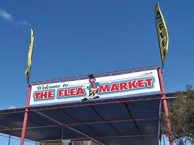 That cheerful flea mascot knows what's waiting inside - California's ultimate treasure hunting playground where memories are made.