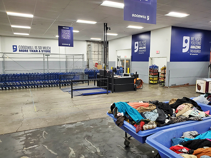 The iconic blue Goodwill logo beckons like a siren call to bargain hunters. This unassuming warehouse exterior hides a treasure trove waiting to be discovered.