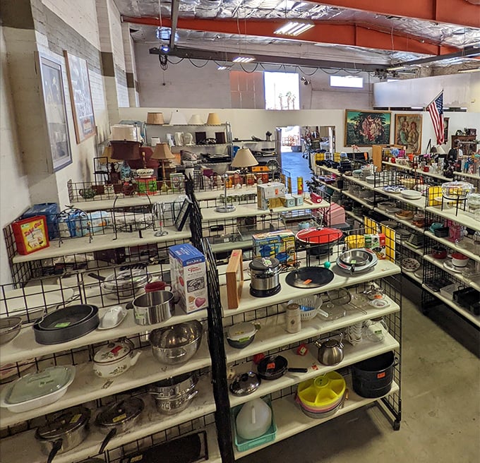 The terrazzo-speckled entrance beckons with promises of hidden treasures. Palm Springs' architectural flair meets thrift store magic at Angel View's downtown location.