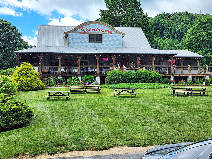 Mountain charm meets culinary delight at Elvira's Cafe, where that blue clapboard exterior and wraparound porch practically whisper "come sit a spell."