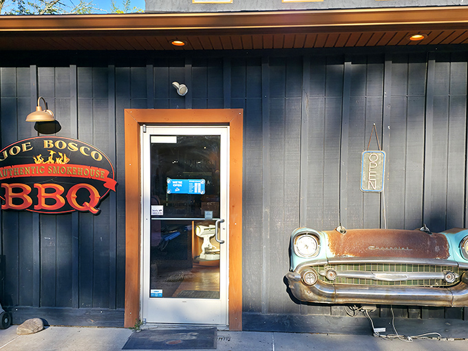 The navy blue exterior with that vintage car front mounted on the wall isn't just decoration&mdash;it's a promise that what awaits inside is classic Americana at its most delicious.