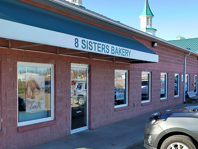 That classic blue awning signals you've arrived at carb heaven. The pink brick building houses enough baking magic to make even the most dedicated dieter temporarily abandon their principles.