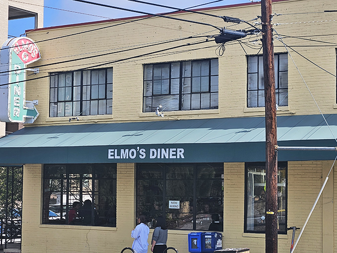 The unassuming exterior of Elmo's Diner stands like a beacon of breakfast hope on Durham's Ninth Street, promising comfort food salvation inside.