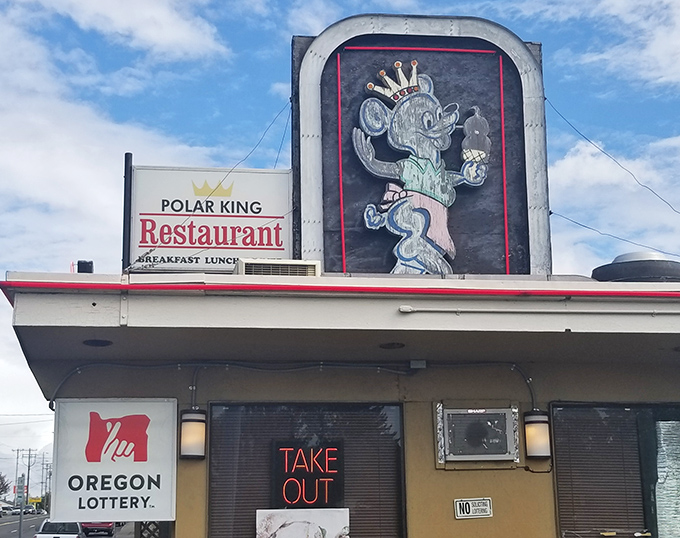 The neon-lit polar bear beckons from the roadside like a nostalgic dream, promising comfort food that never goes out of style.