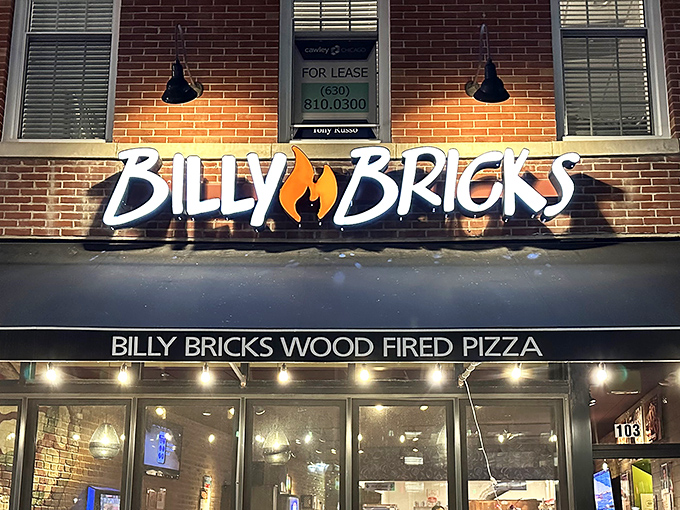 Downtown Wheaton's brick facade hides a pizza paradise where locals gather under black awnings for wood-fired bliss.
