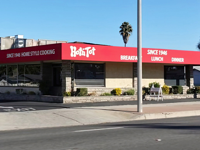 The iconic red awning of Hot N Tot stands as a beacon of comfort food in Lomita, promising homestyle cooking that's been satisfying hungry Californians since 1946.