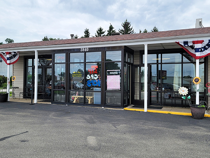 The unassuming exterior of Ma and Pop's Country Kitchen proves that patriotic bunting and cheerful sunflowers are the universal language for "get in here, hungry traveler."