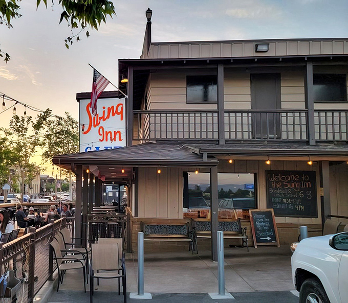 The two-story exterior promises adventure, with American flags waving like they're cheering for your appetite.
